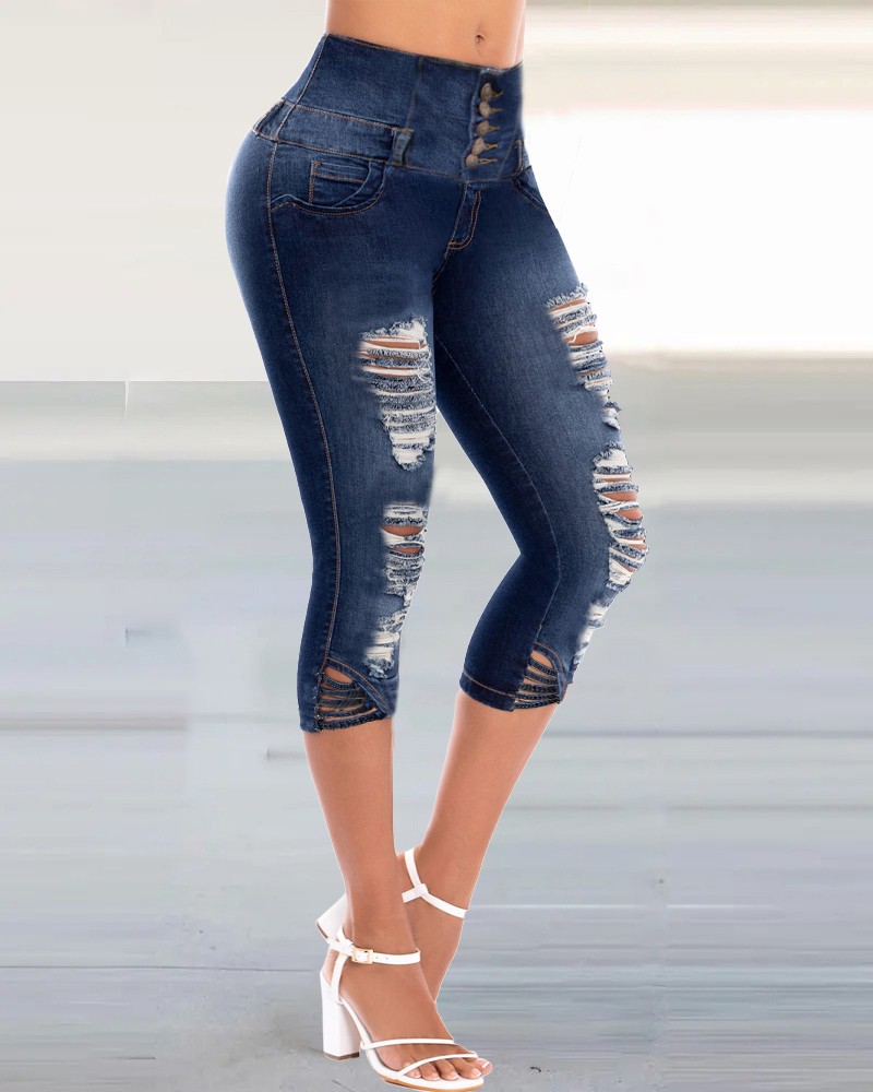 Jeans rasgados con cremallera y cintura alta con botones y cremallera